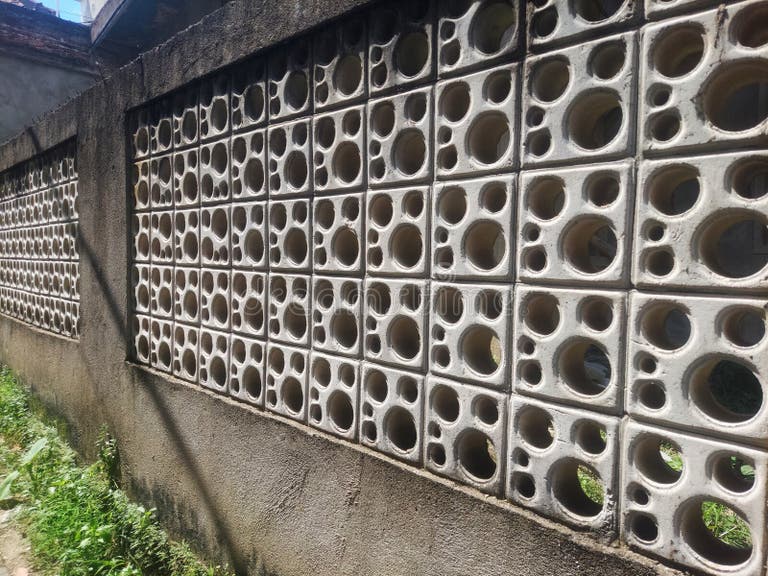 Cement Ventilation Wall with Artistic Circular Holes Creating Geometric ...