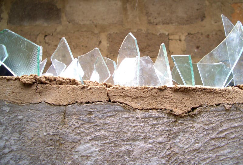 Cement Wall Covered with Broken Glass Pieces Stock Photo - Image of ...