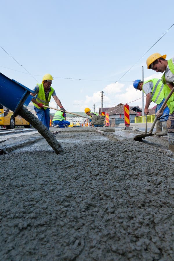 Cement workers editorial image. Image of pouring, team - 55284655