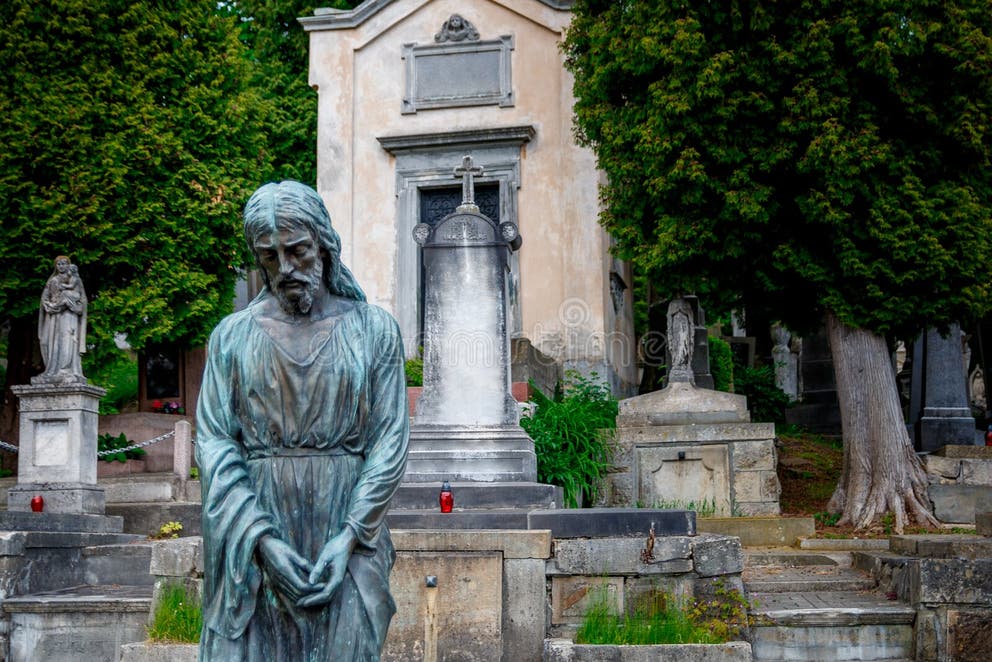 Cemetery with a Sad Man Statue on the Foreground. Stock Image - Image ...