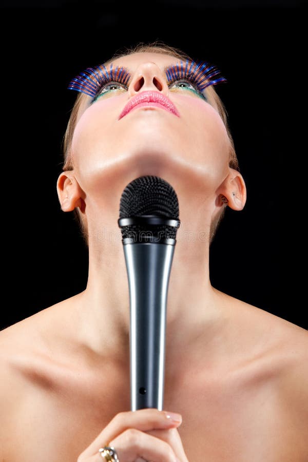 Cemetrical Composition of a Female Singer and Mic Stock Photo - Image ...