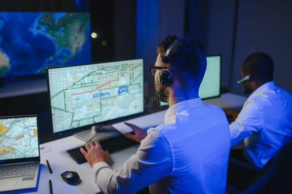 Center of Dispatching Maintenance. Portrait of Men Working Via Headset Microphone while Sitting ...
