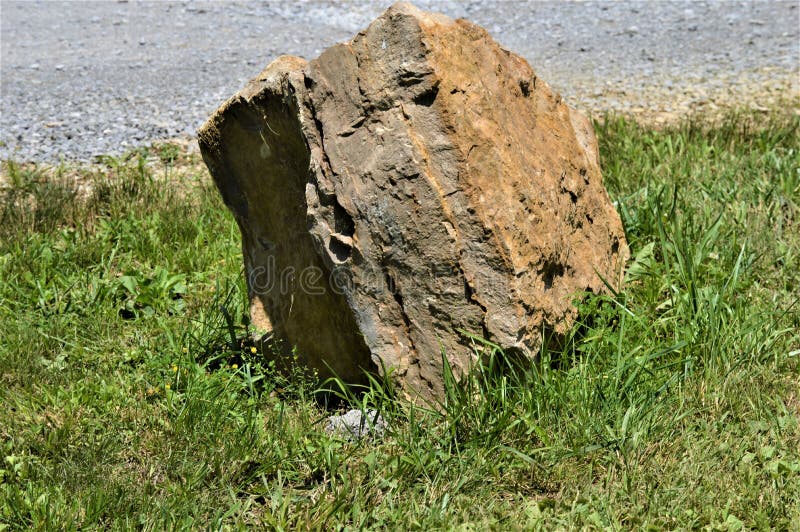 Centered Large Brown Tan Square Rock in Front of Gravel Path Stock ...