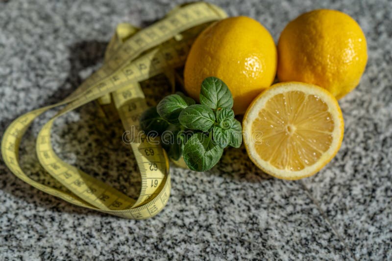 Centimeter Together with Two Lemons and Half Stock Photo - Image of ...