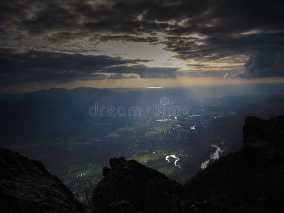 Sun Shining through Cloudy Sky Over Valley Stock Photo - Image of hills ...