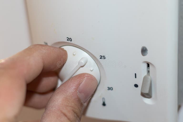 Central Heating Thermostat Control Dial Adjustment Stock Photo - Image ...