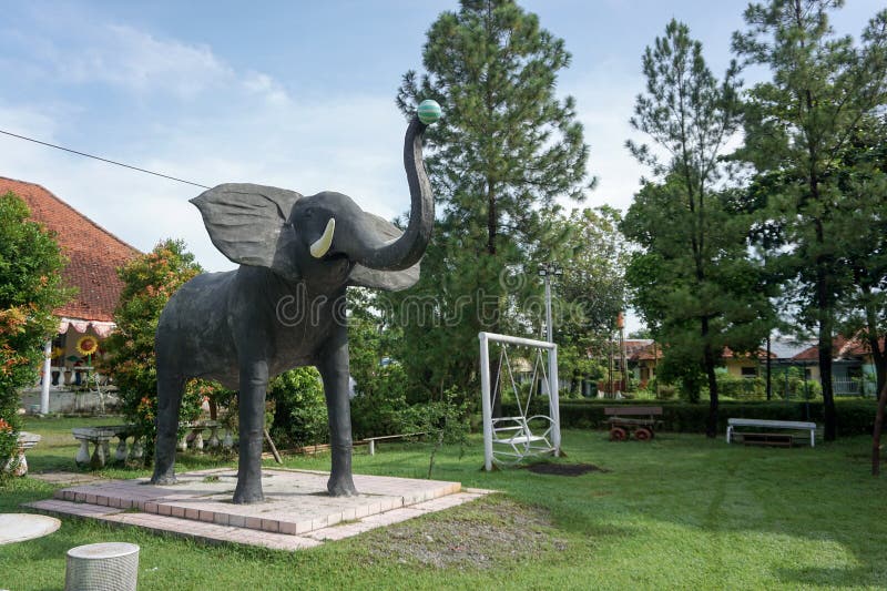Elephant Figure in a Garden with Negative Space on the Right Editorial ...