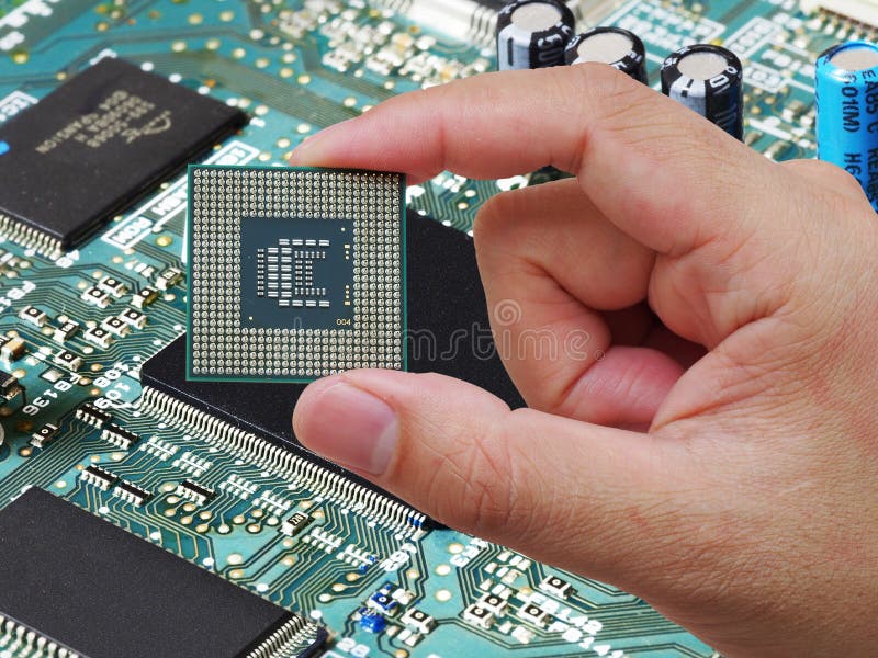 Central Processing Unit (CPU) in Hand on Printed Green Computer Stock ...
