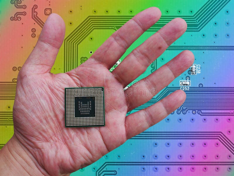Central Processing Unit (CPU) in Hand on Printed Green Computer Stock ...