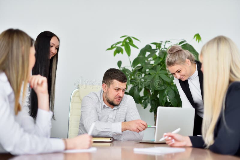 CEO at a Meeting with Female Employees Explains New Ideas Using a ...