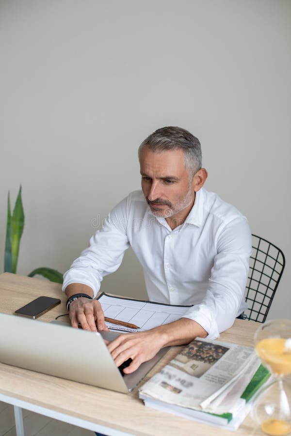 CEO Sitting at His Working Place and Working on the Laptop Stock Image ...