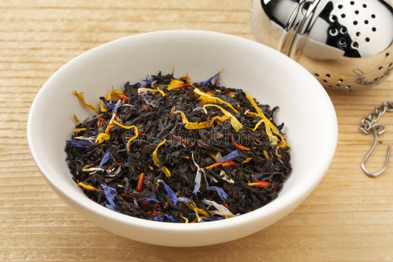 Ceramic Bowl with Black Tea with Dried Flower Leaves Stock Image ...