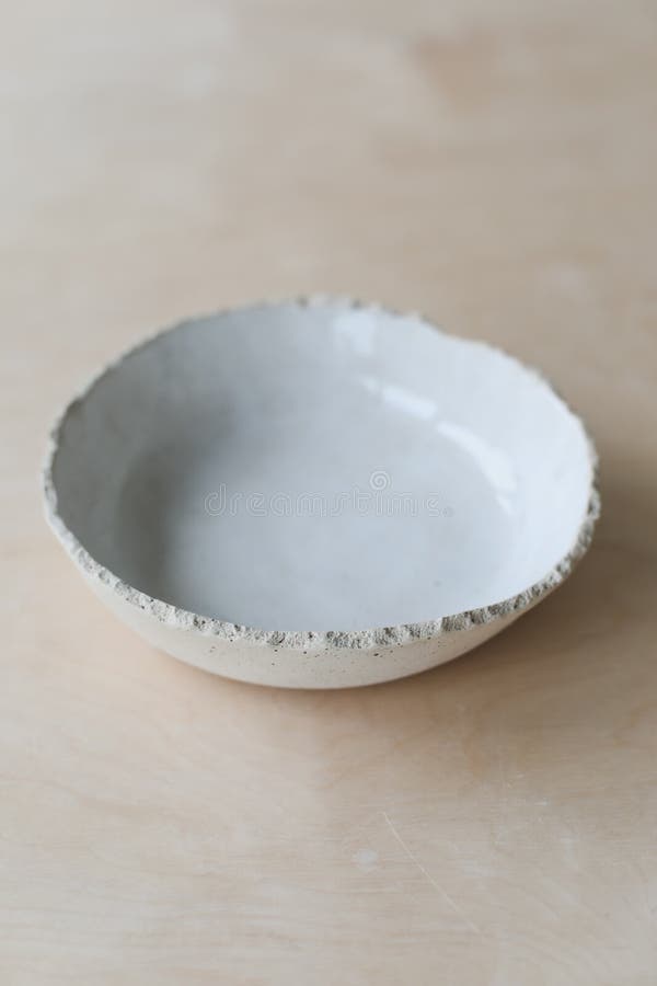 Ceramic Bowl on a Wooden Table Top View. Handmade Ceramic Tableware and ...