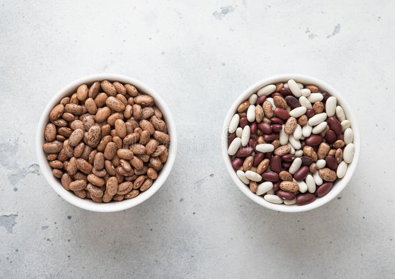 Ceramic Bowls with Variegated and Mixed Raw Dry Beans on Kitchen Table ...