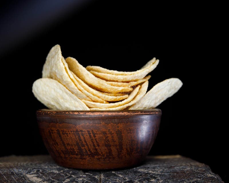 A Ceramic Cup of Chips Stands on the Surface of the Table Stock Image ...