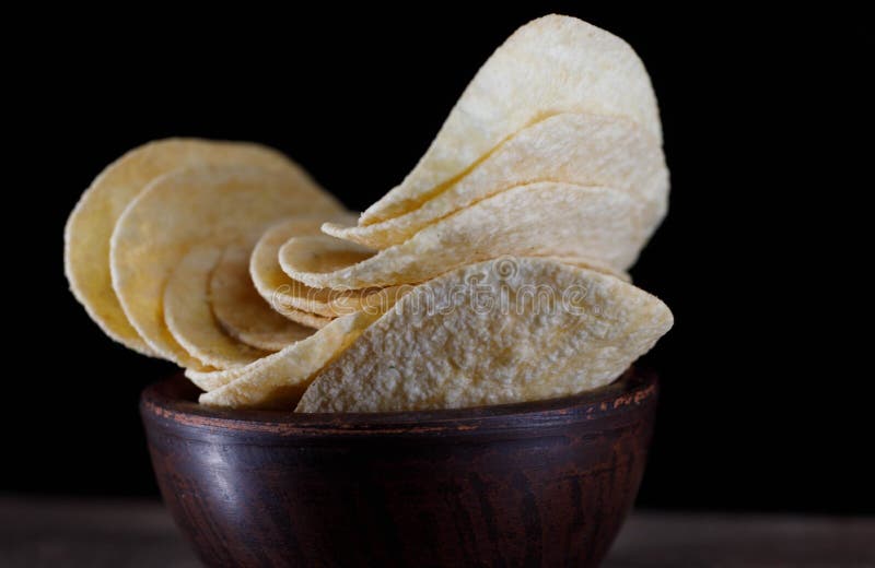 A Ceramic Cup of Chips Stands on the Surface of the Table Stock Photo ...