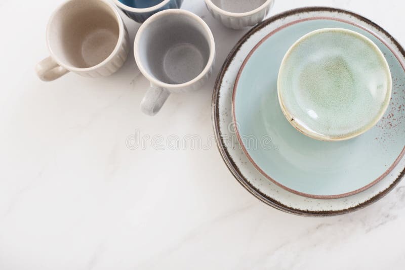 Cups and Plates on White Marble Table Stock Photo - Image of ceramics ...