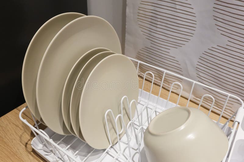 Ceramic Dishes and Bowls in Plate Rack Stock Photo - Image of drain ...