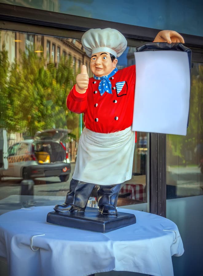 Ceramic Figurine of a Chef is Holding a Blank Sheet in His Hands ...