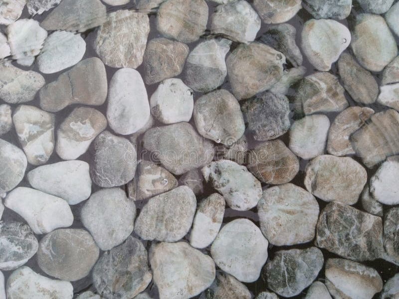 Ceramic Floor with a Motif of Several Stones Under the Water in the ...