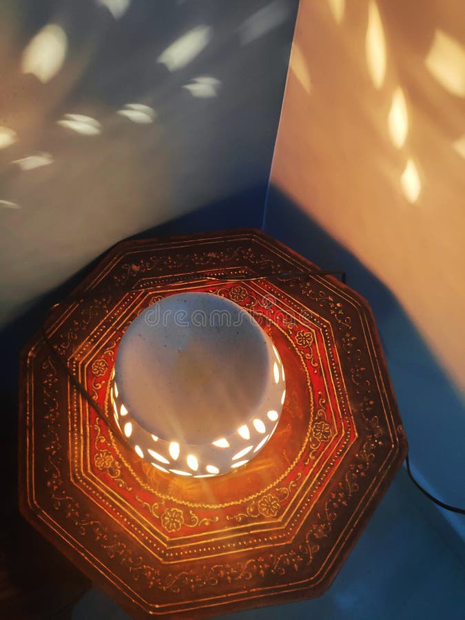 The Ceramic Lamp with Holes Casting Spotty Light Pattern and Shadow on ...