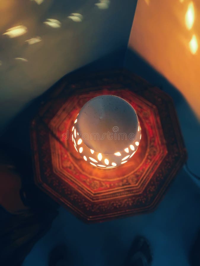 The Ceramic Lamp with Holes Casting Spotty Light Pattern and Shadow on ...