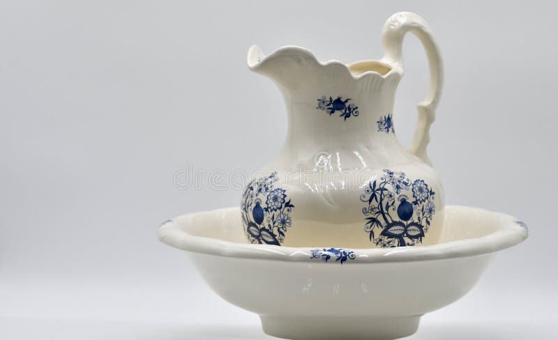Ceramic Pitcher and Basin Set Featuring Floral Patterns Displayed on a ...