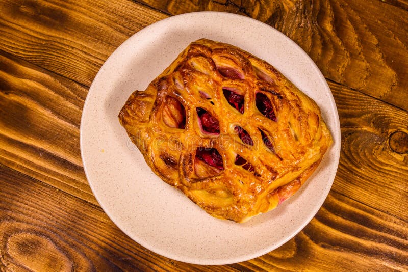 Ceramic Plate with Fresh Cherry Strudel on Wooden Table. Top View Stock ...