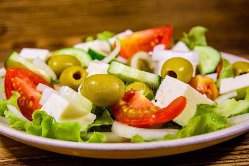Ceramic Plate with Greek Salad on Wooden Table Stock Photo - Image of ...