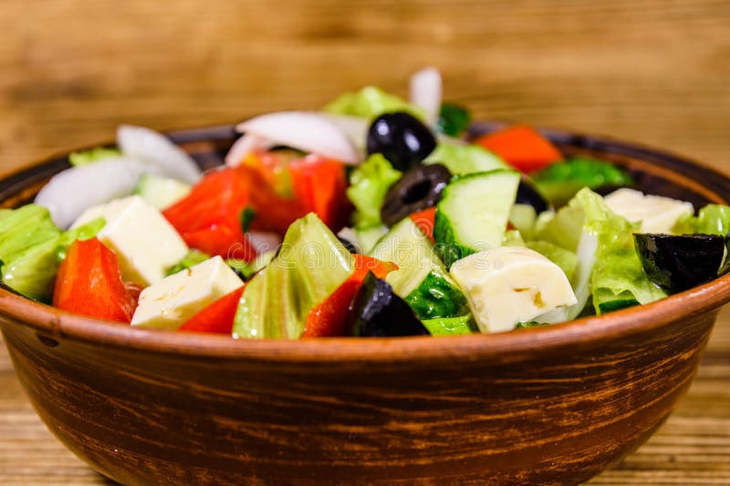 Ceramic Plate with Greek Salad on Wooden Table Stock Image - Image of ...