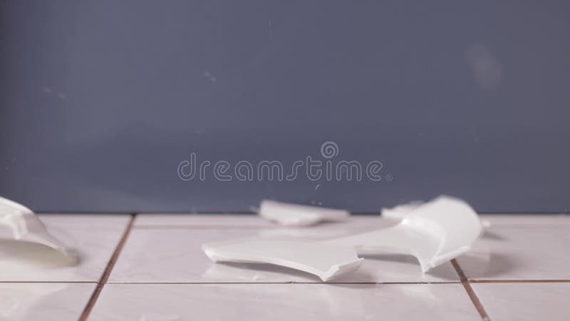 Ceramic Plate Hitting the Floor Breaking To Pieces Stock Video - Video ...