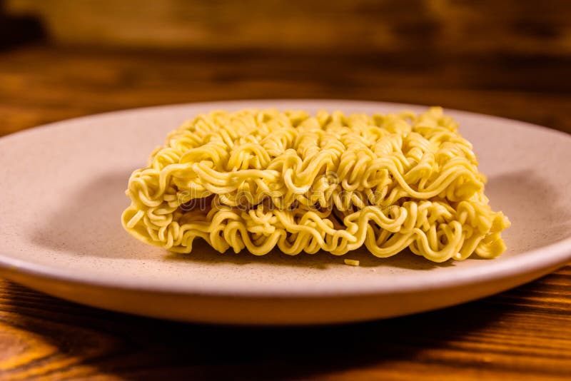 Ceramic Plate with Instant Noodles on Wooden Table Stock Photo - Image ...