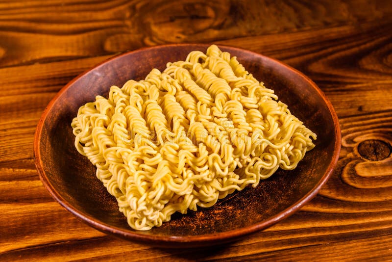 Ceramic Plate with Instant Noodles on Wooden Table Stock Photo - Image ...