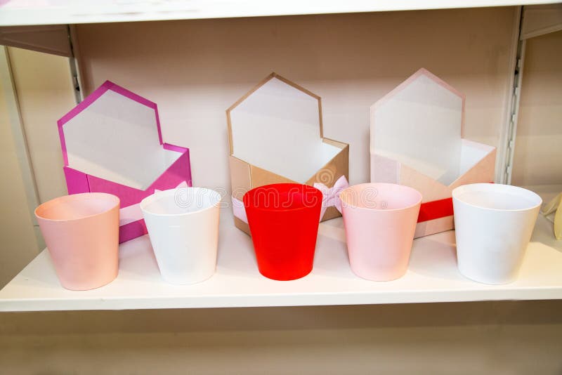 Ceramic Pots and Boxes with Bows of Red, Pink, White Colors Standing on ...