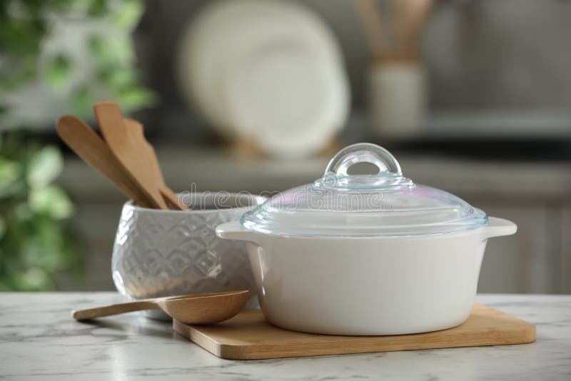 Ceramic Pots and Cooking Utensils on White Marble Table in Kitchen ...