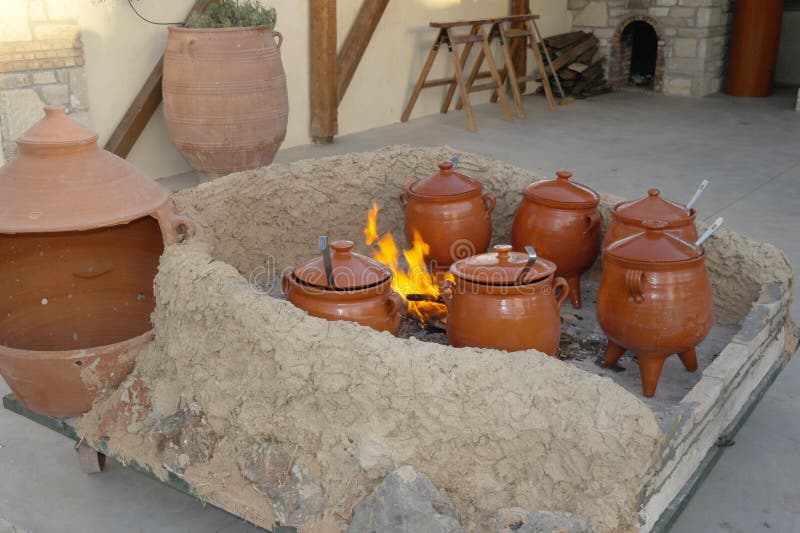 Ceramic Pots with Food on a Fire Stock Image - Image of flame, crete ...