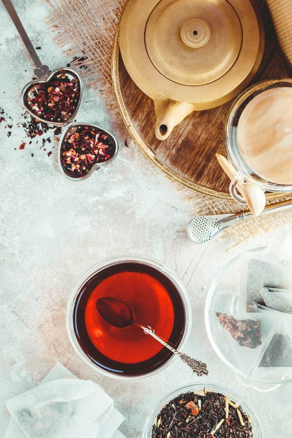 Ceramic Tea Pot, Metal Tea Infuser and Cup of Black Tea. Composition ...
