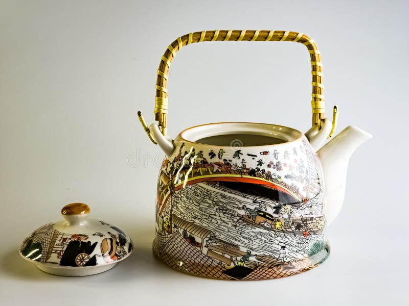 Ceramic Teapot and Lid with Abstract Pattern and Wicker Straw Handle on ...