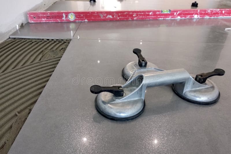 Ceramic Tiles and Tools for Tiler. Floor Tiles Installation Stock Image ...