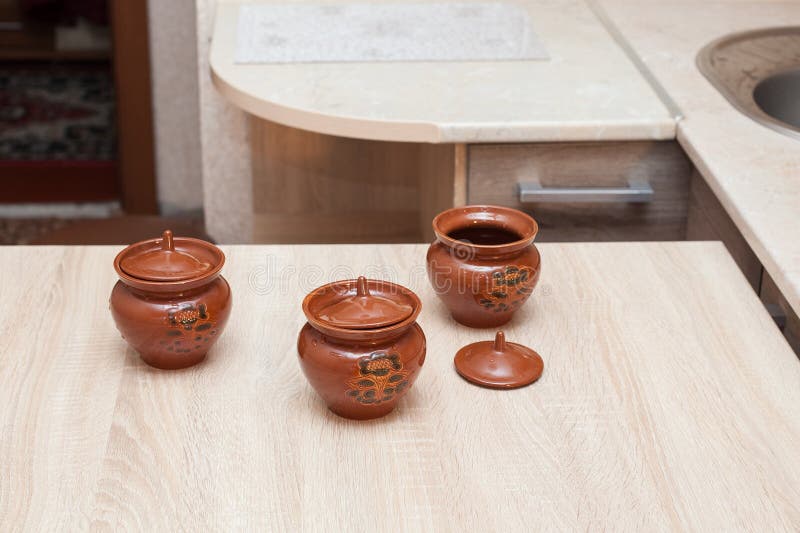 Ceramic Vintage Brown Pots for Cooking are on the Table, in the Kitchen ...