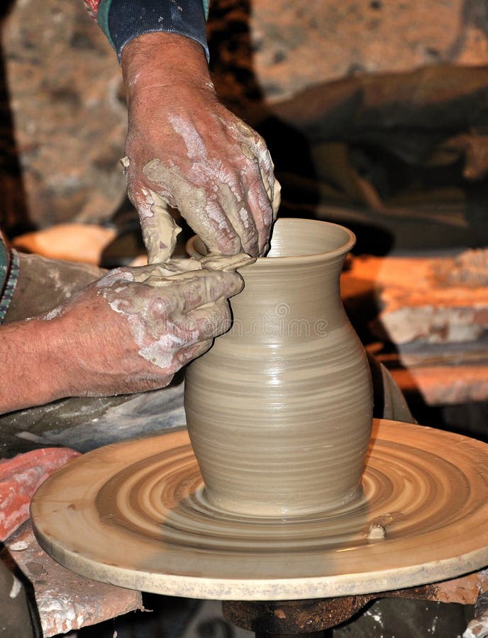 A Potter making clay pots stock image. Image of artist - 98189519