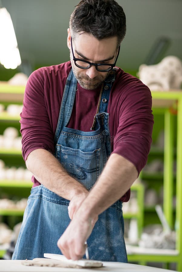 Ceramist Dressed in an Apron Working with Raw Clay in Bright Ceramic ...