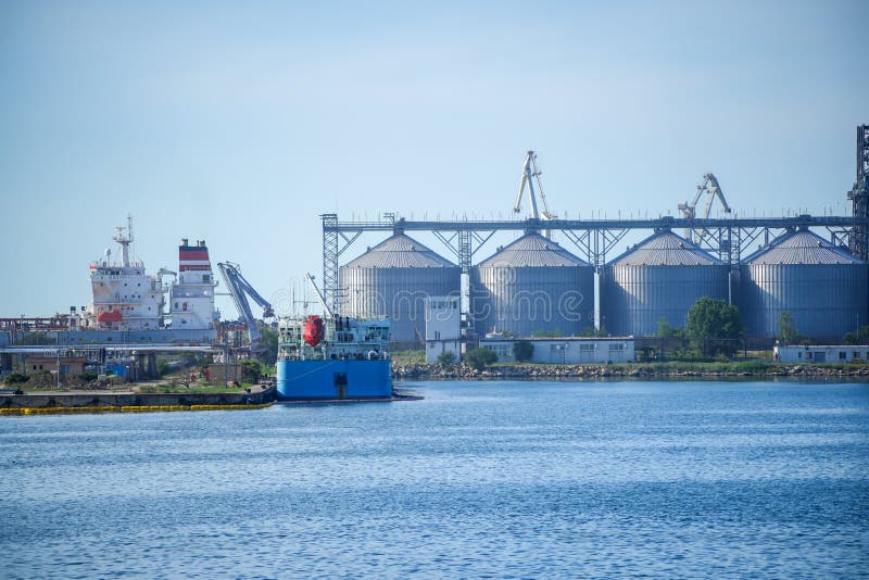 Cereal warehouse in a port stock photo. Image of factory - 280481912