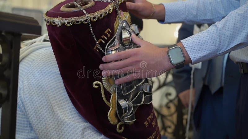 Ceremony Featuring a Torah Scroll Along with Attendees Dressed in ...