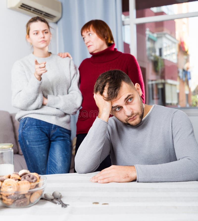 Chagrined Guy Having Problems in Relationship with Family Stock Image ...