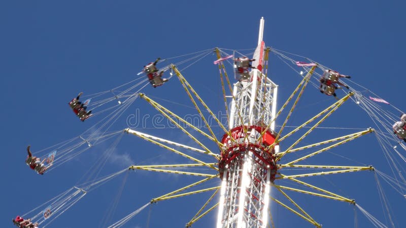 Flying Swing Carousel. Blue Sky in the Background. Stock Video - Video ...