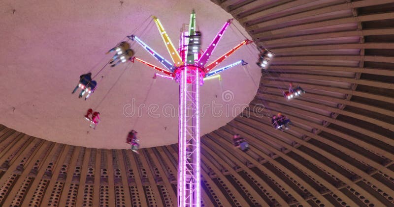 The Chain Carousel Rotates in the Amusement Park. Colorful Seats ...