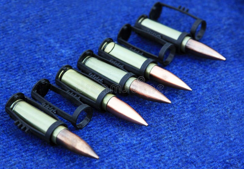 Chain of Cartridges on Blue Background Stock Photo - Image of close ...