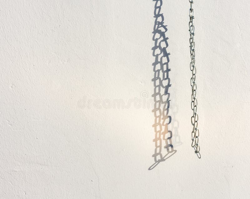 A Chain in Front of a White Wall with Shadows Stock Image - Image of ...