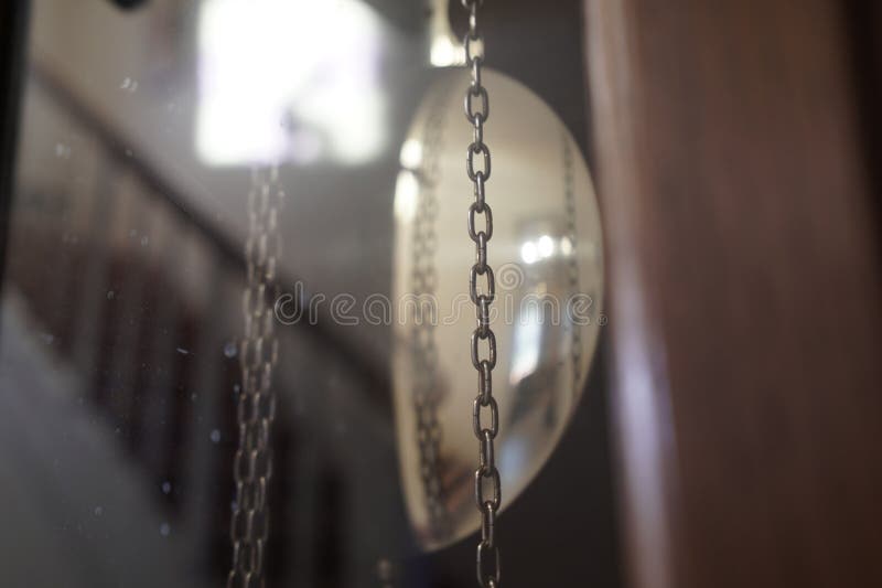 A Chain Hangs from a Clock, and the Chain is Silver Stock Photo - Image ...